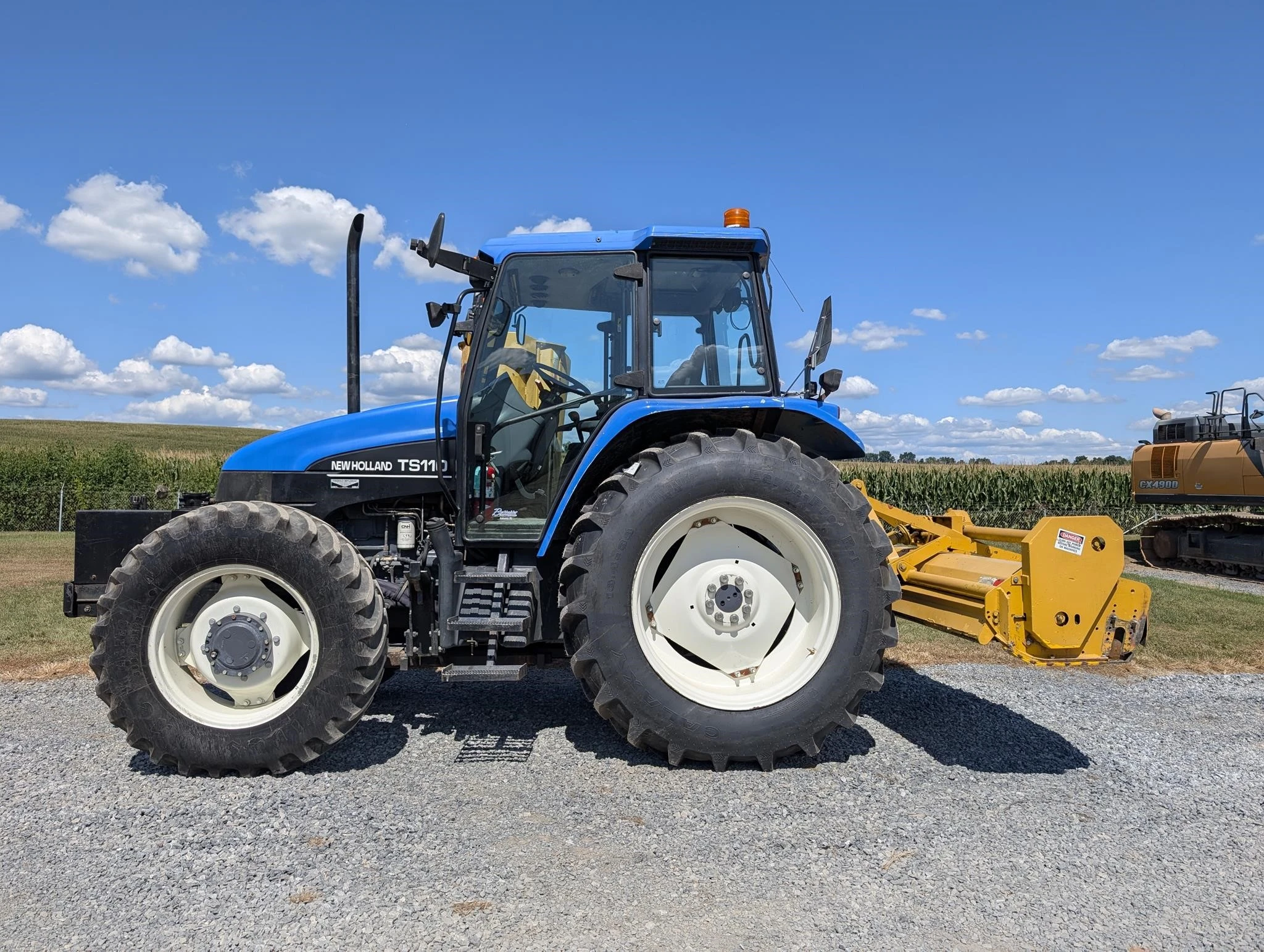 TS100 Tractor With Alamo Boom Mower For Sale - New Holland Agriculture ...